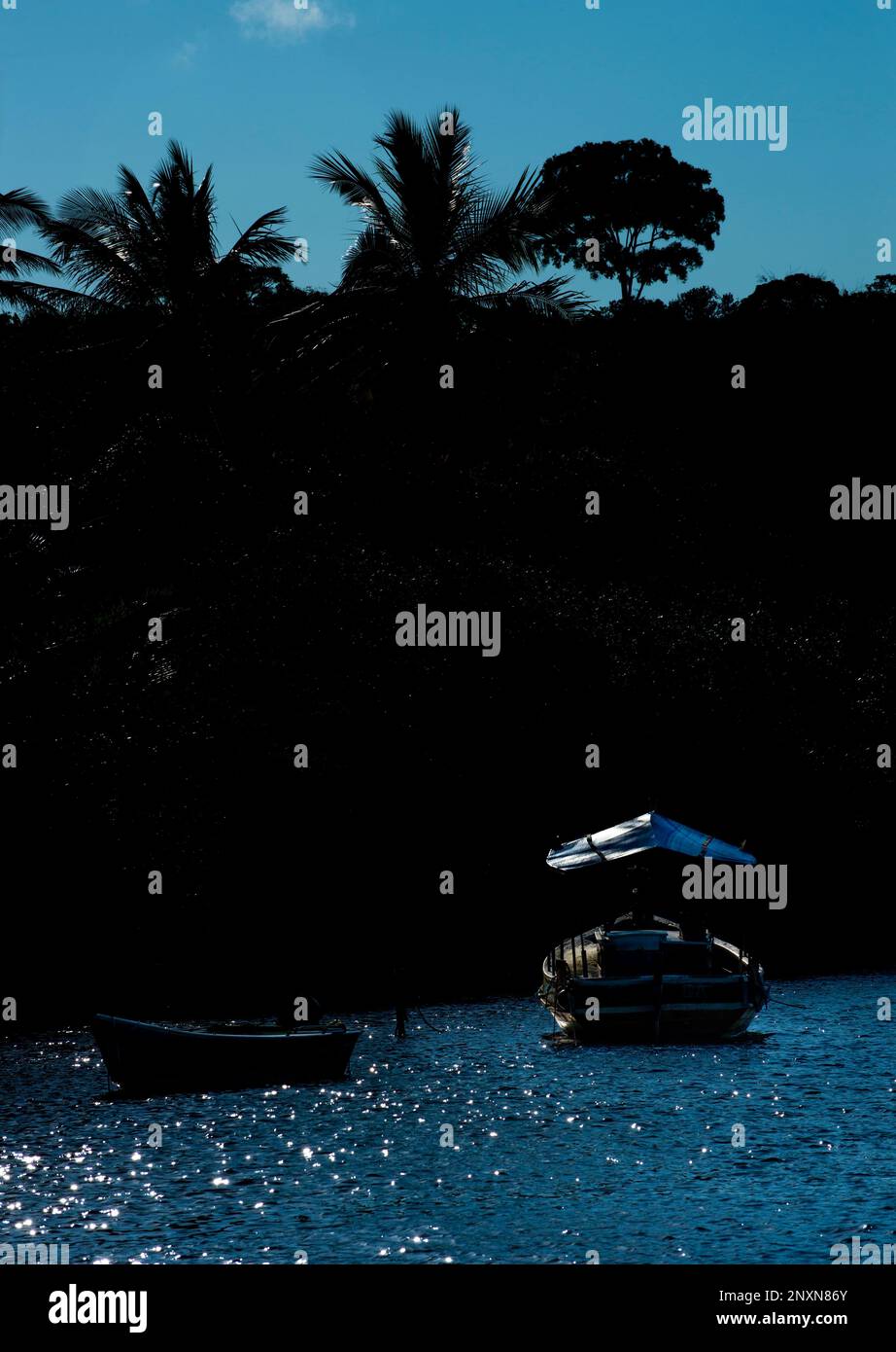 two fishermen boats standing in deep blue water Stock Photo - Alamy