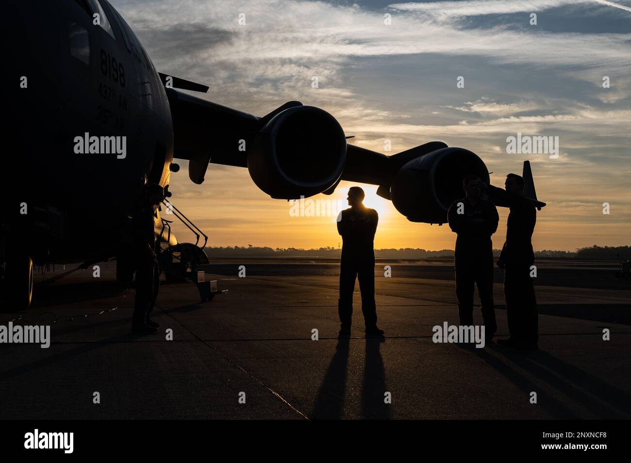 Aircrew members assigned to the 15th Airlift Squadron prepare to ...