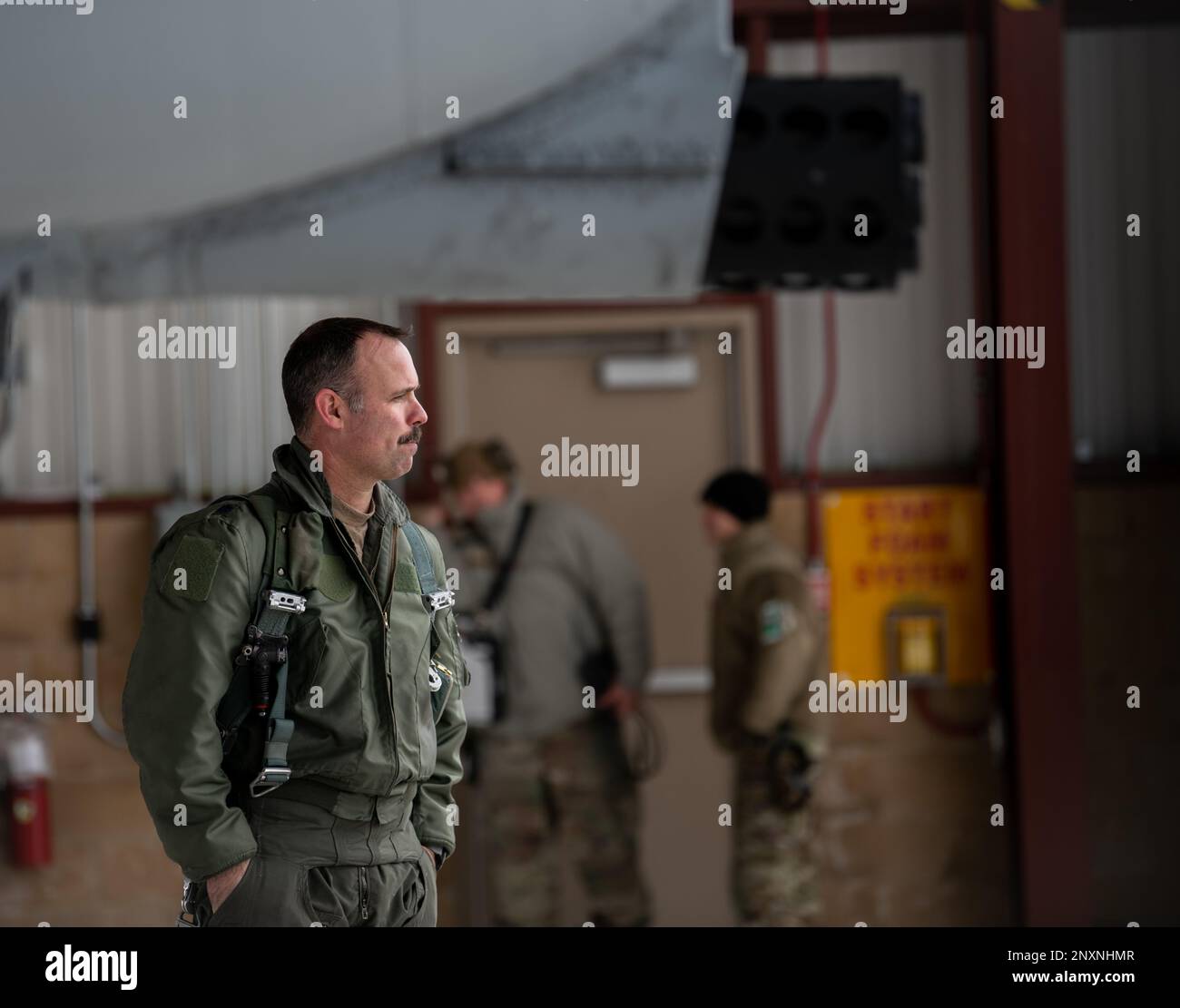U.S. Air Force Lt. Col. Scott Boatright gazes through the hangar door ...