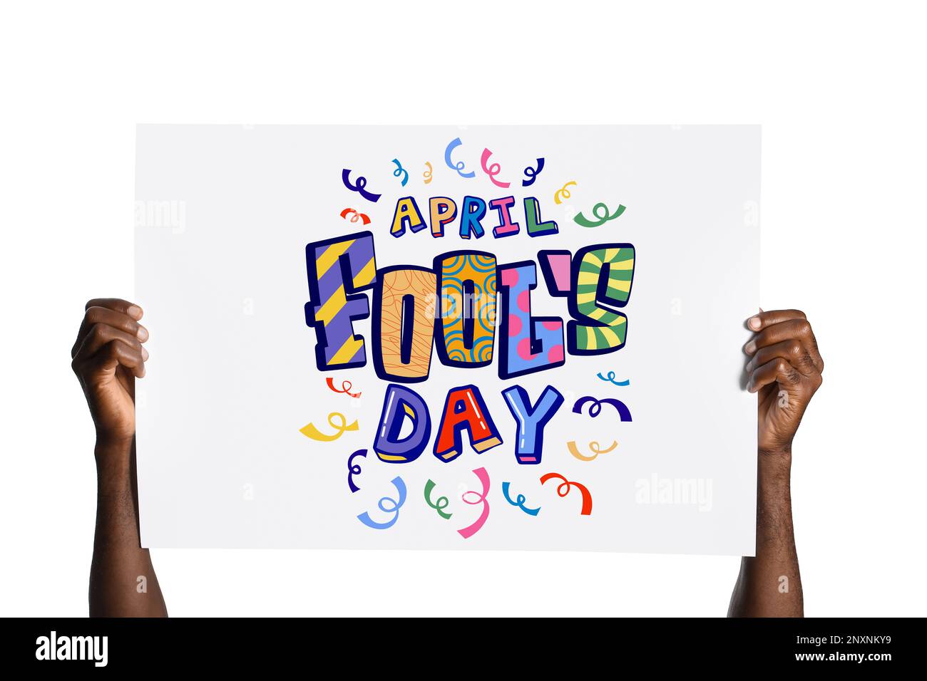 Hands of African-American man holding poster with text APRIL FOOLS DAY ...