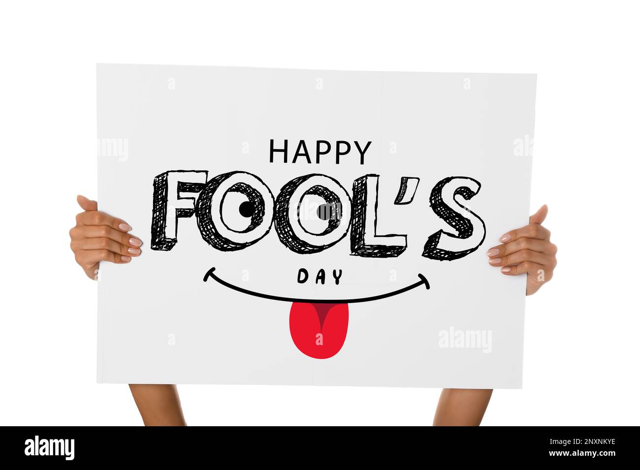 Female hands holding poster with text HAPPY FOOLS DAY on white ...