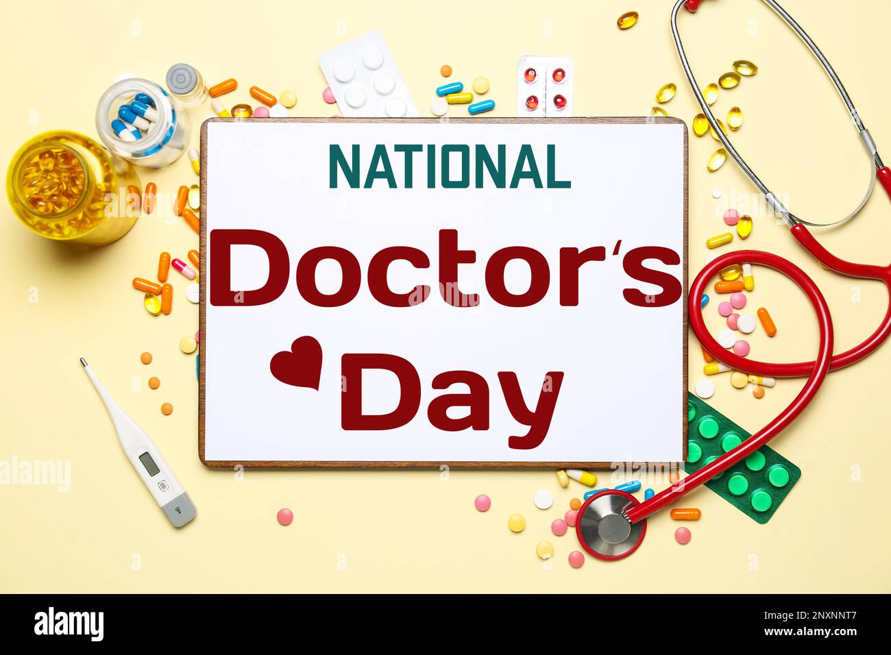 Paper with text NATIONAL DOCTORS DAY, stethoscope and drugs on beige ...
