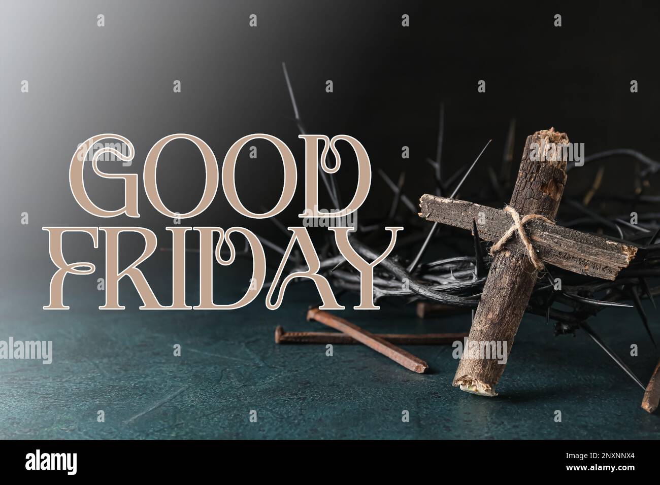 Wooden cross, crown of thorns, nails and text GOOD FRIDAY on dark ...