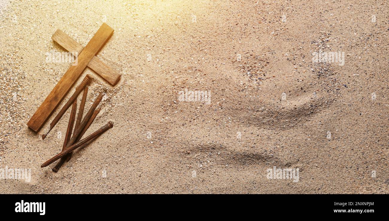 Banner with wooden cross and nails on sand. Good Friday concept Stock ...