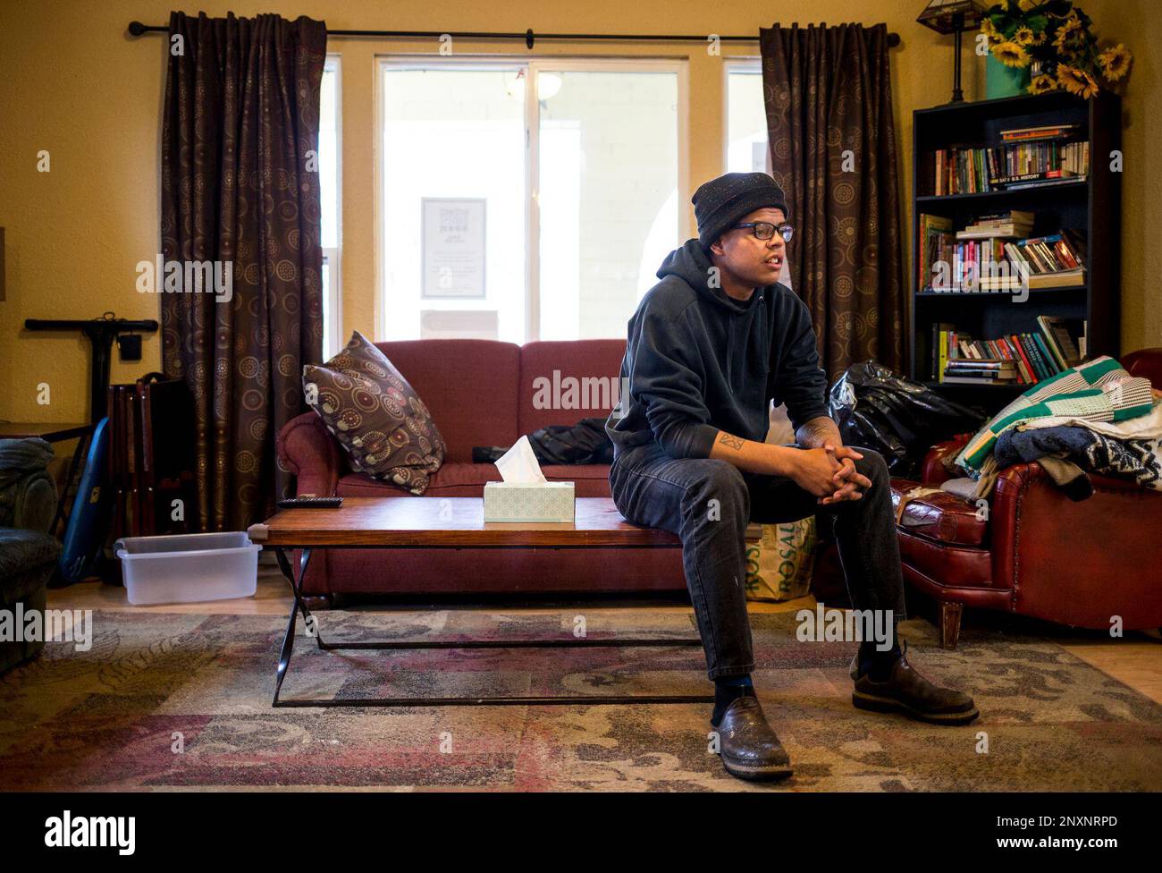 In this Jan. 5, 2018 photo, Cory Butler sits in the living room of Rod ...