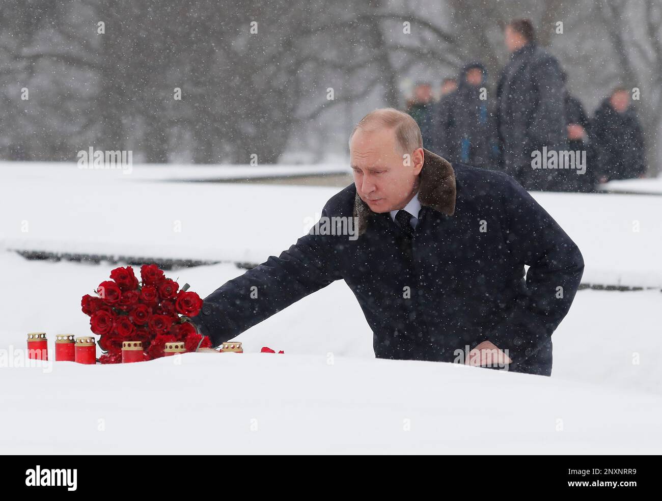 Russian President Vladimir Putin lays flowers during a ceremony at the ...