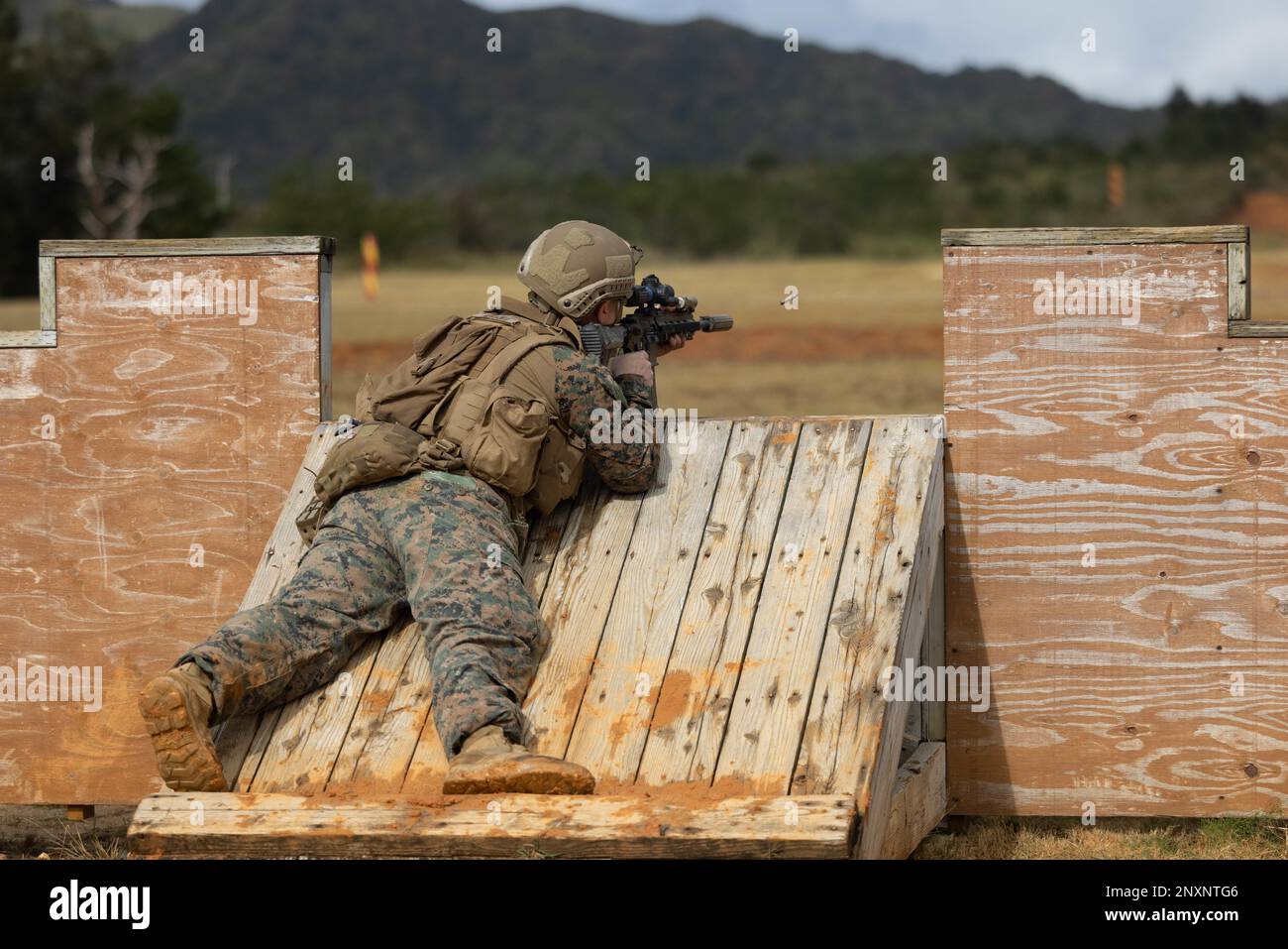 A U.S. Marine with 3d Marine Division participates in a live-fire range ...