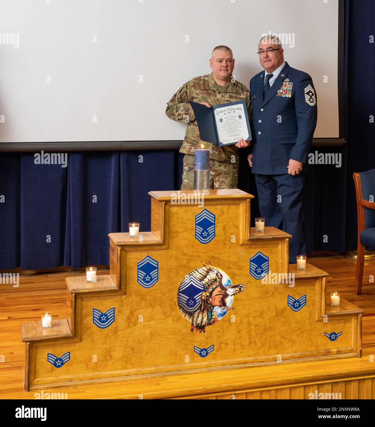 Chief Master Sgt. Jason Everetts, left, is presented a certificate from ...