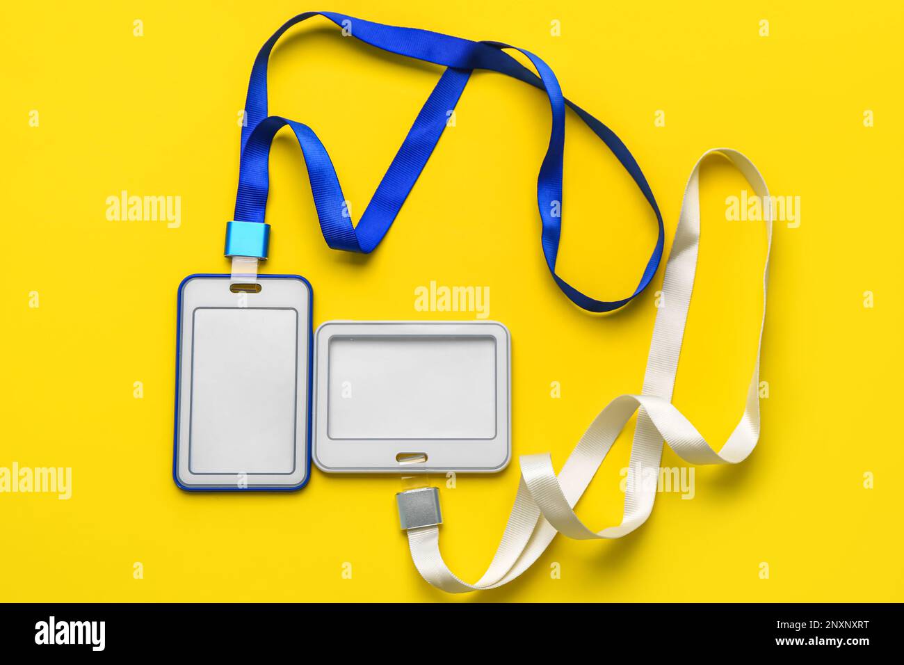 Blank badges on yellow background Stock Photo - Alamy