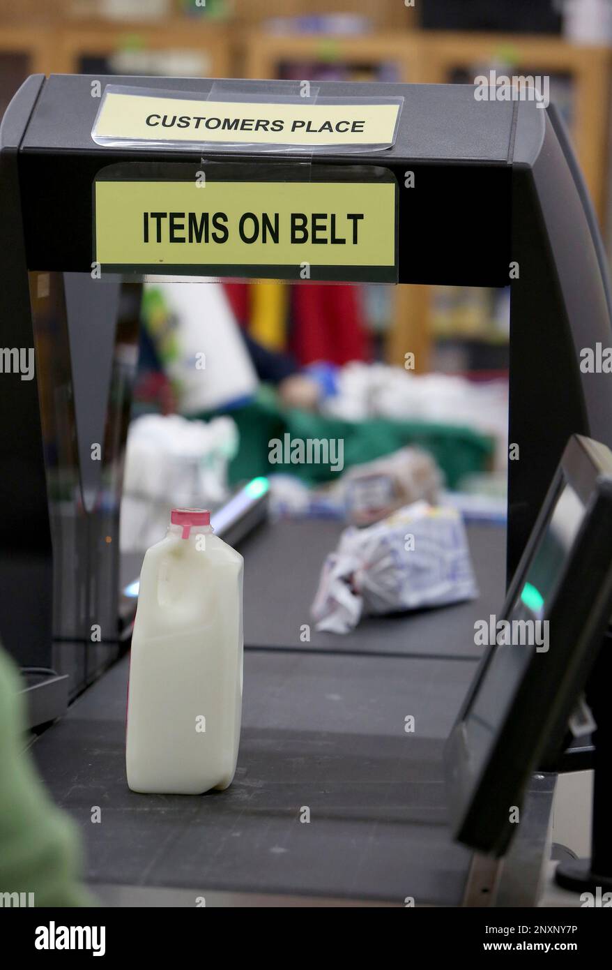 ADVANCE FOR MONDAY, JAN. 22 Items on a checkout belt at Woodman's on ...