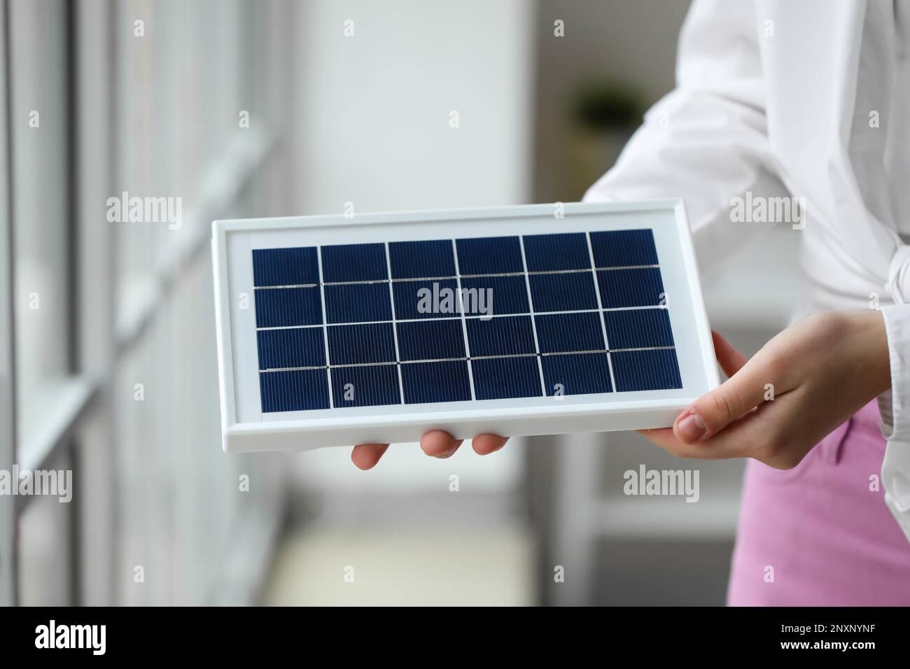 Teenage girl with portable solar panel at home, closeup Stock Photo - Alamy
