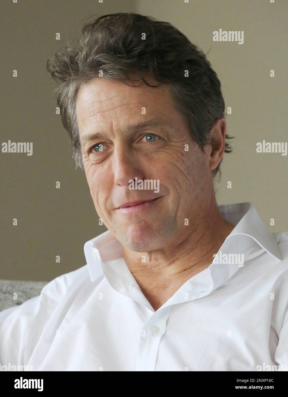 British actor Hugh Grant speaks during an interview in Tokyo on Jan.17 ...