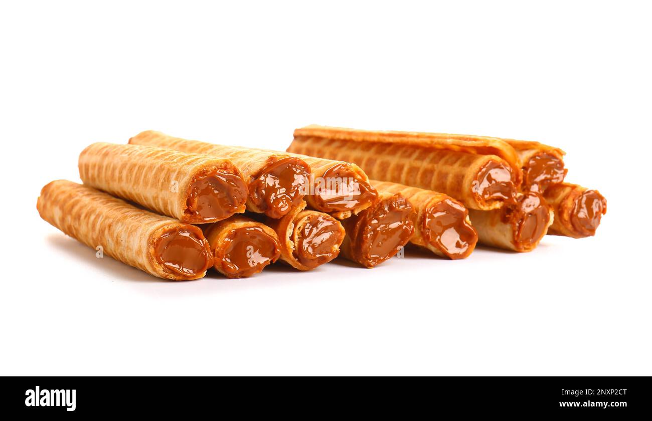 Stack of delicious wafer rolls with boiled condensed milk isolated on ...