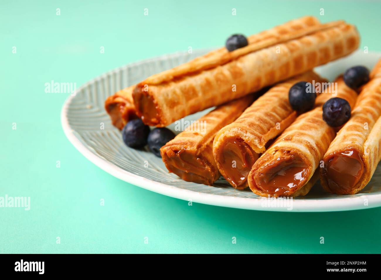 Plate of delicious wafer rolls with boiled condensed milk and ...