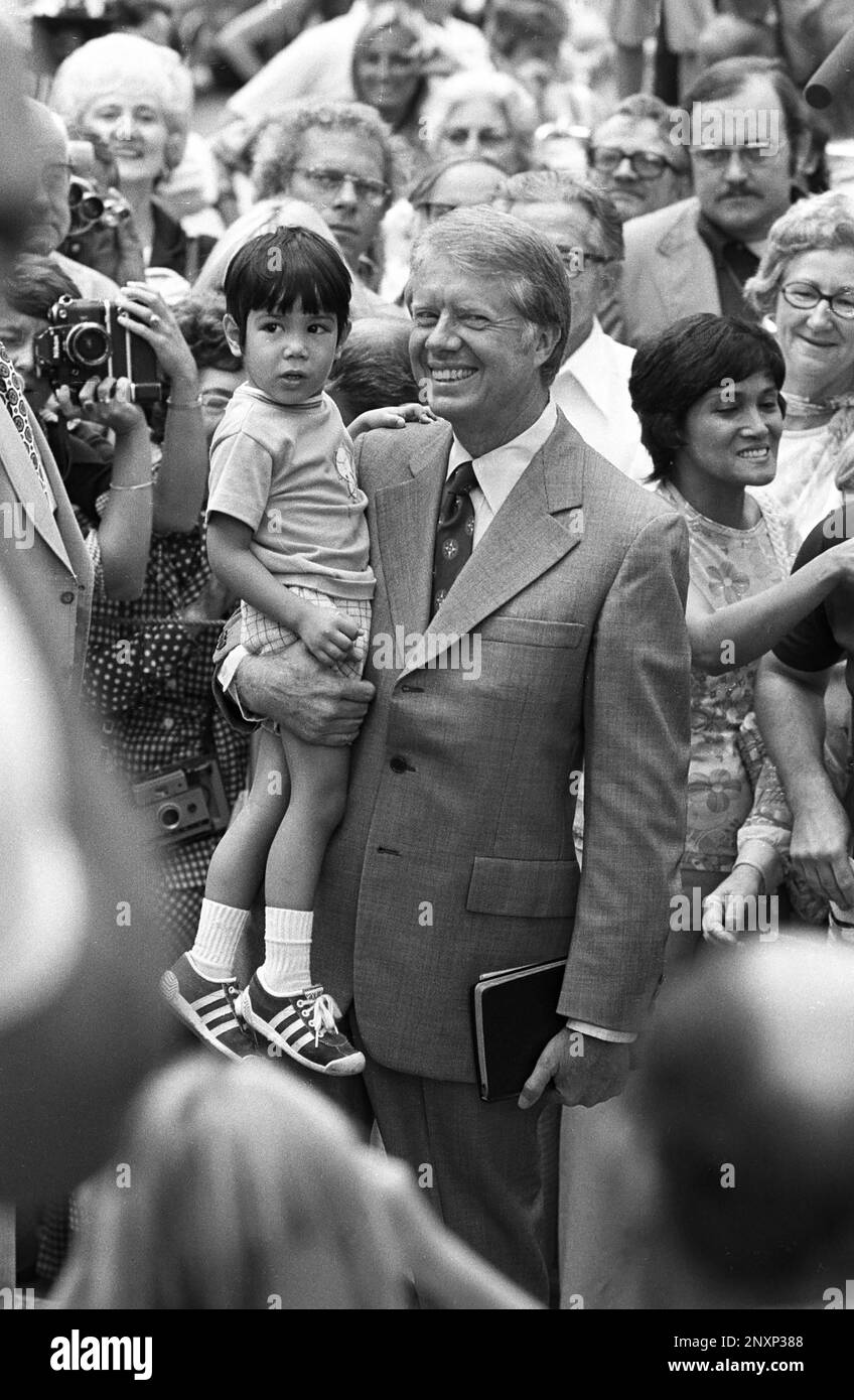 1976, Florida, USA: A smiling JIMMY CARTER holding boy while ...