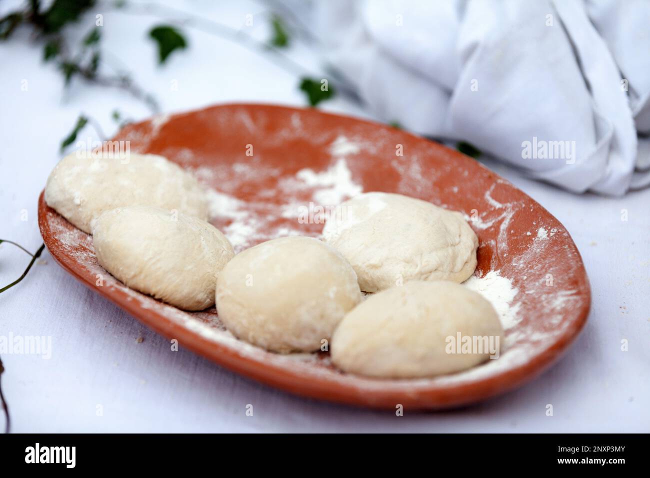 Fouace doughs, (also known as fouée) on a tray. It is a round and airy ...