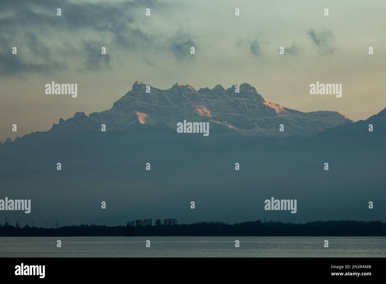 Sunset on jagged peaks of the Dents du Midi in the Chablais Alps canton ...