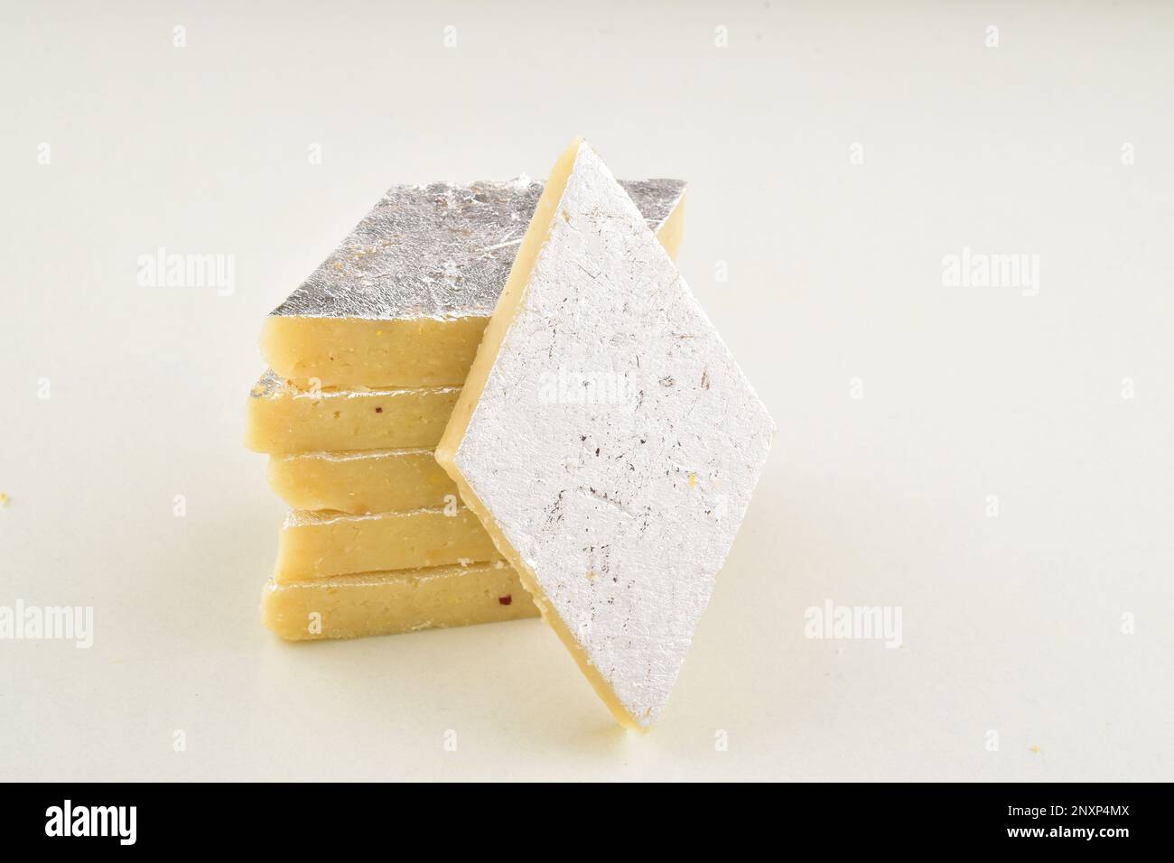 Closeup of kaju katli isolated on white background Stock Photo - Alamy