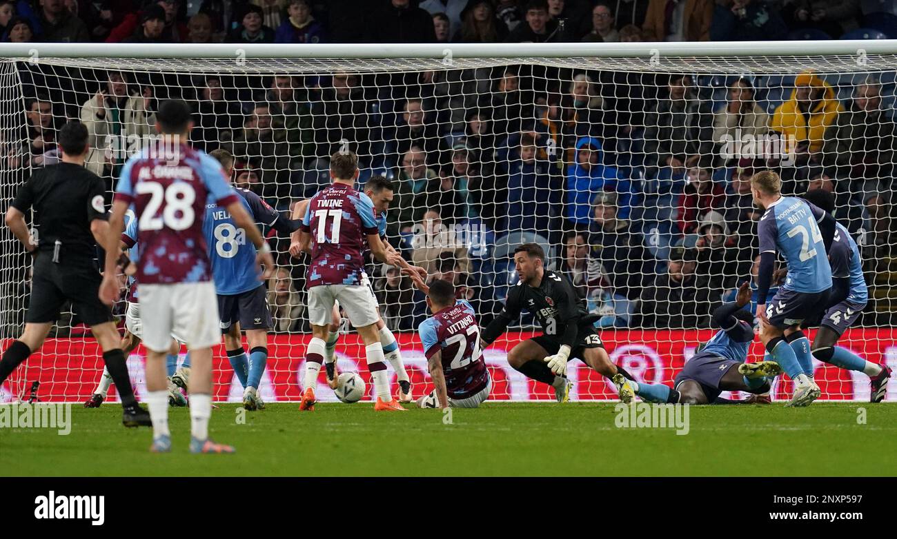 Burnley's Connor Roberts (second left) backheels their side's first ...