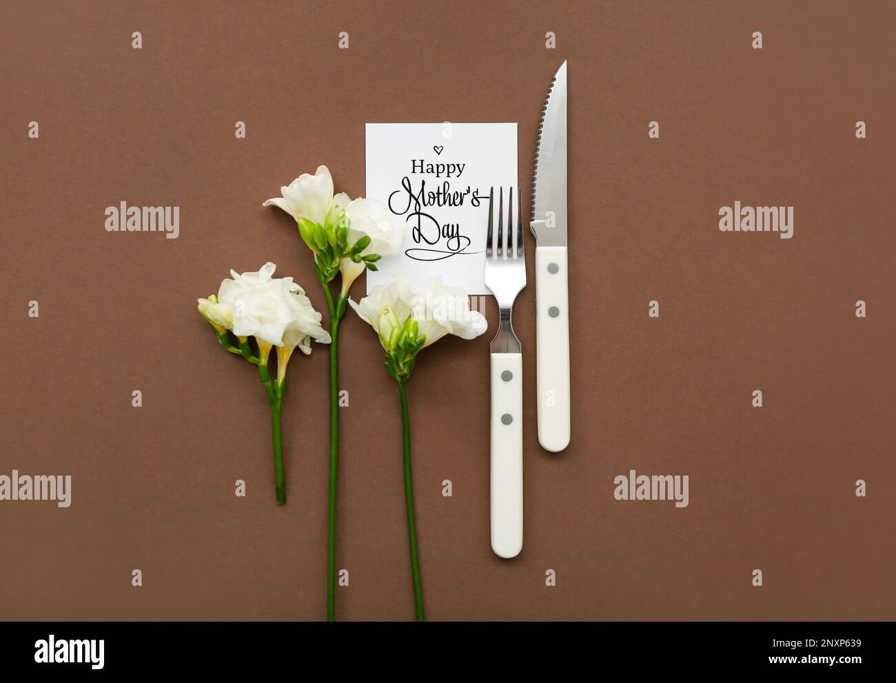 Greeting card with text HAPPY MOTHER'S DAY, cutlery and eustoma flowers ...