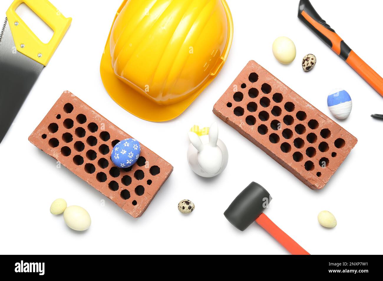 Easter rabbit with eggs and builder's tools on white background Stock ...