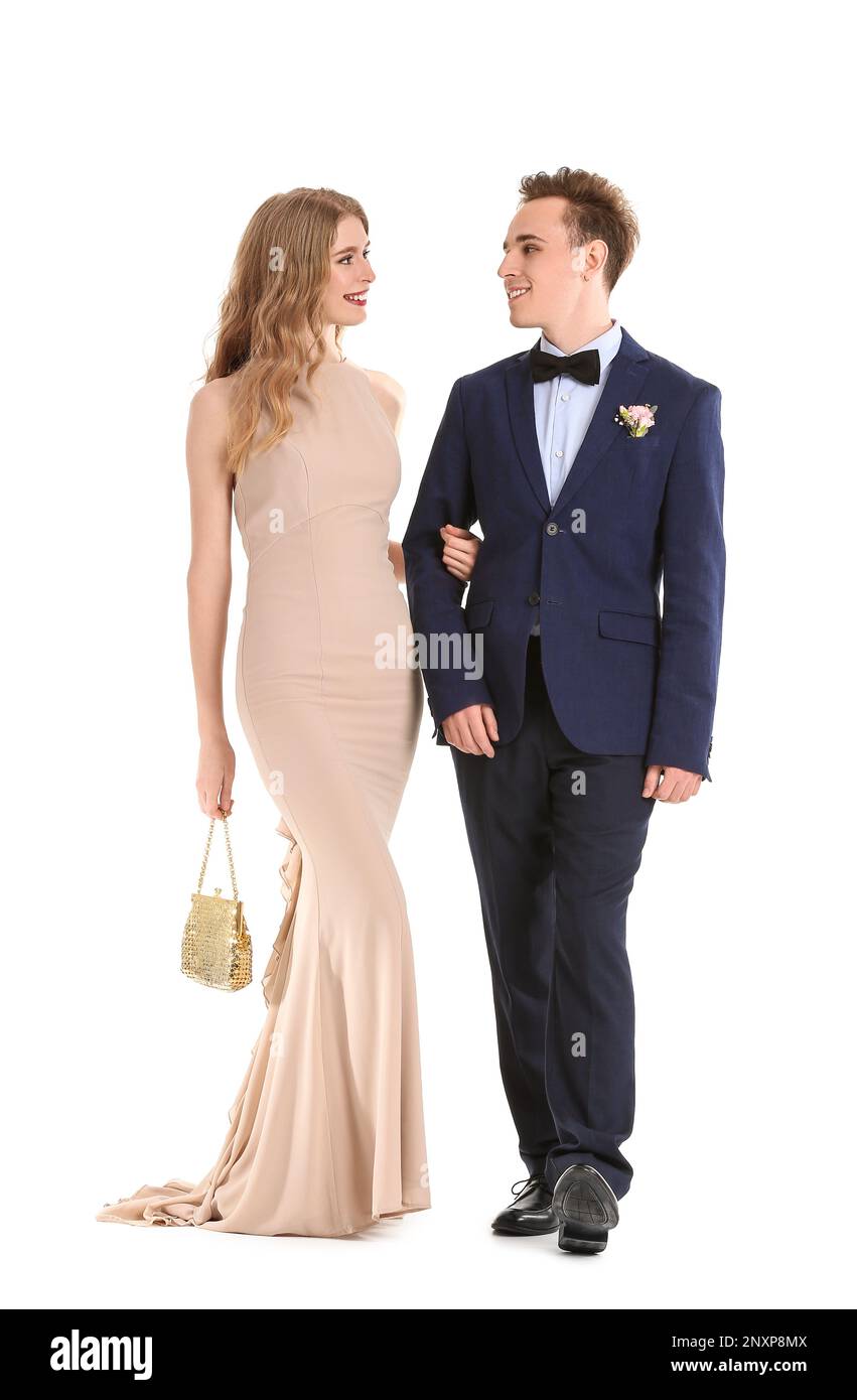 Beautiful couple dressed for prom on white background Stock Photo - Alamy