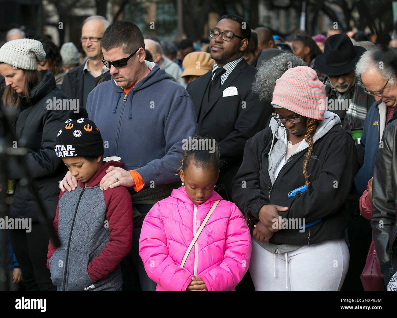 From left, Eric Marshall and his son Aiden Marshall, Pastor Corey Tabor ...