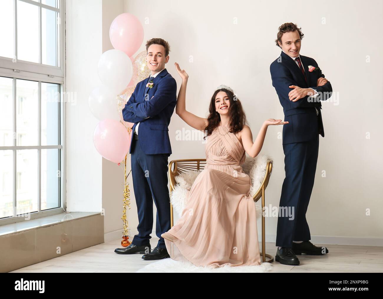 Teenage boys and girl dressed for prom in room Stock Photo - Alamy