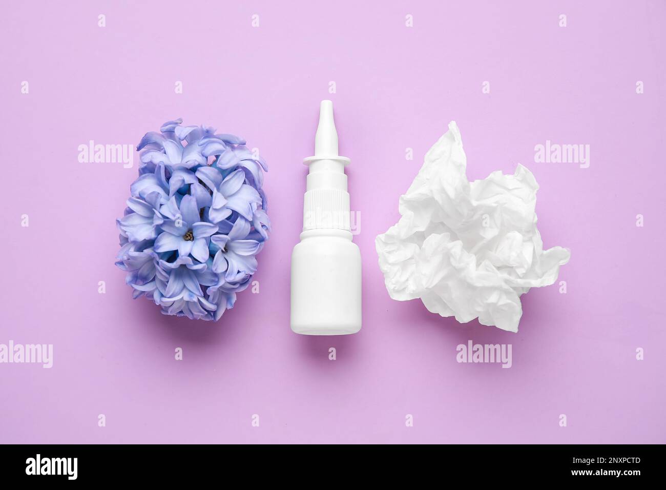 Nasal drops with flower and tissue on lilac background. Seasonal ...