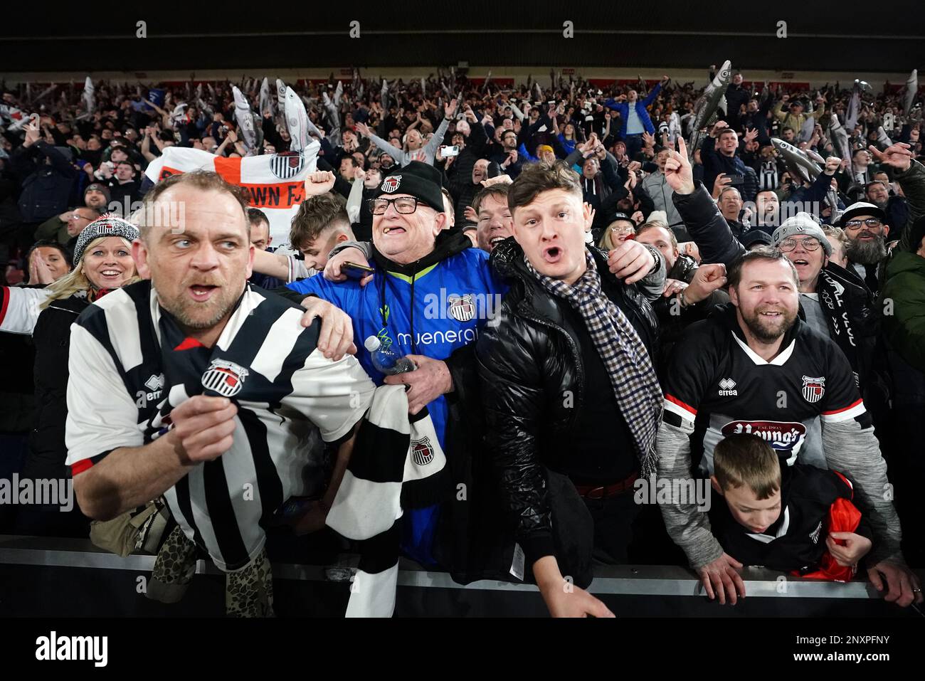 Grimsby Town fans celebrate after the Emirates FA Cup fifth round match ...