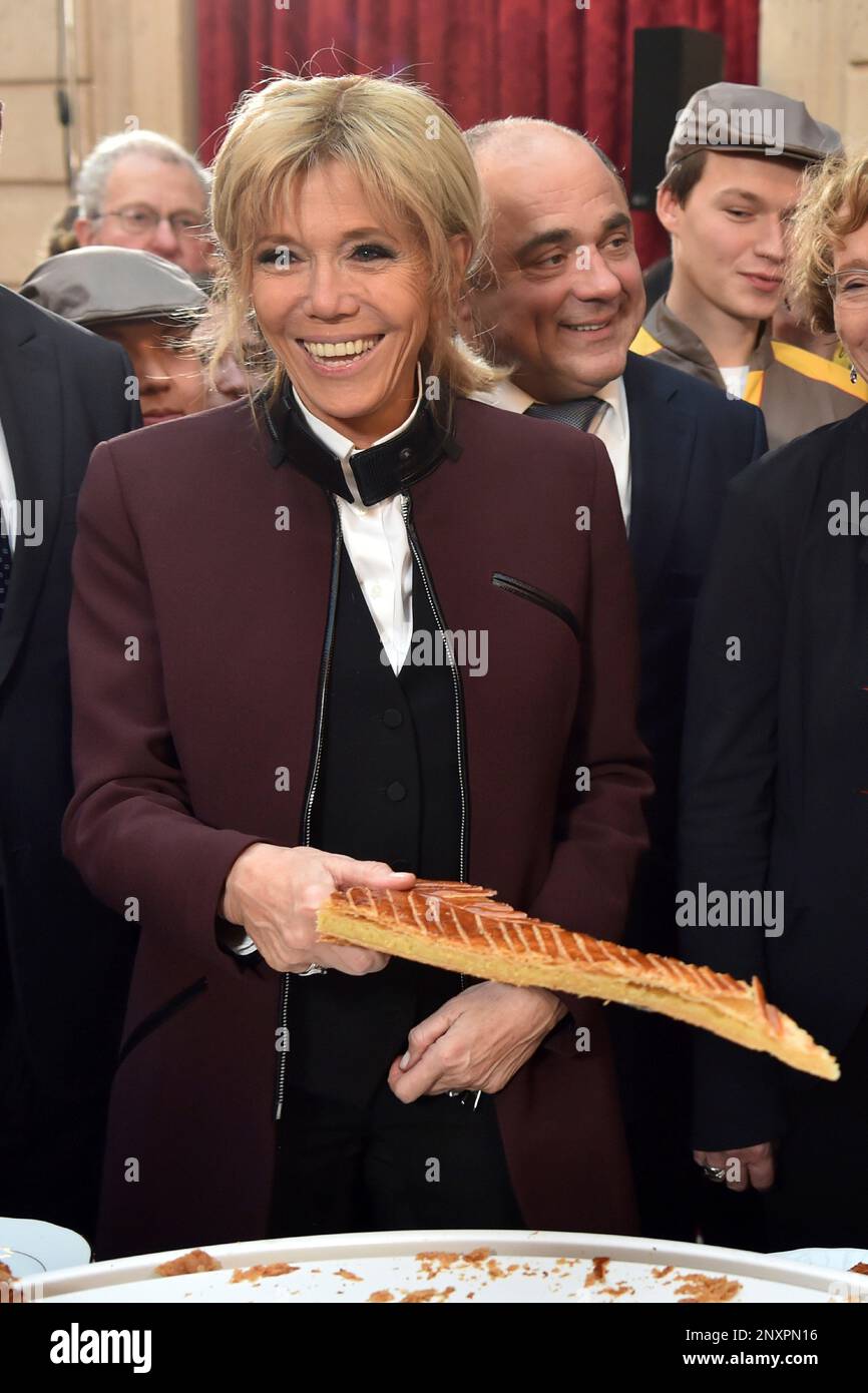 Brigitte Macron the wife of French President Emmanuel Macron holds a ...