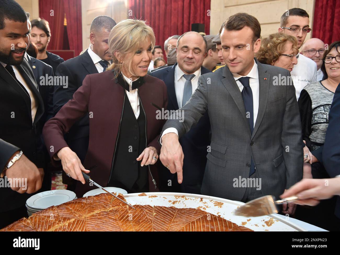 French President Emmanuel Macron, right, and his wife Brigitte Macron ...