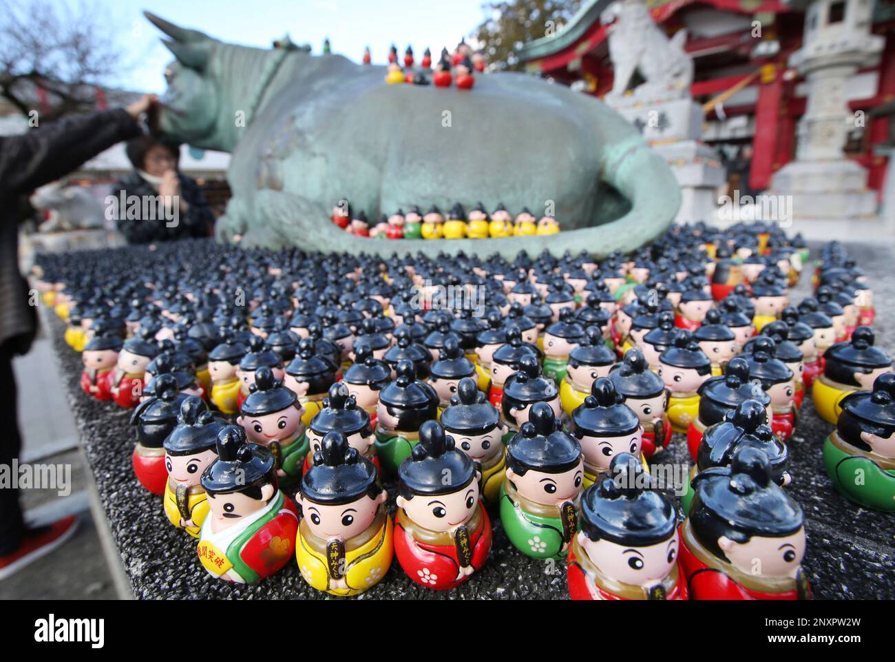 Sugawara no Michizane dolls are put around a statue of cow at Nagoya ...