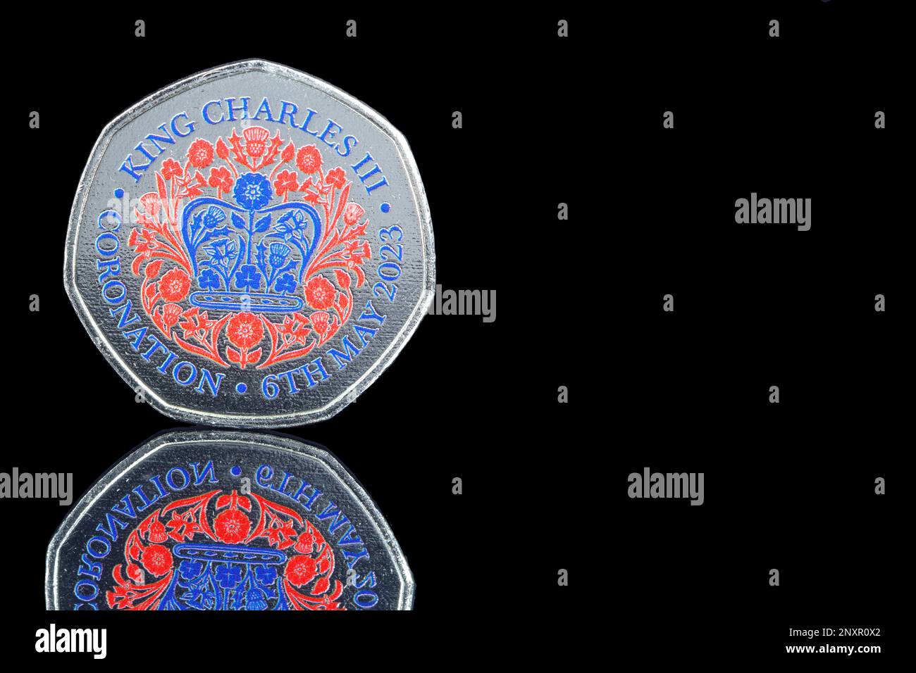 A souvenir featuring the official emblem for the coronation of King ...