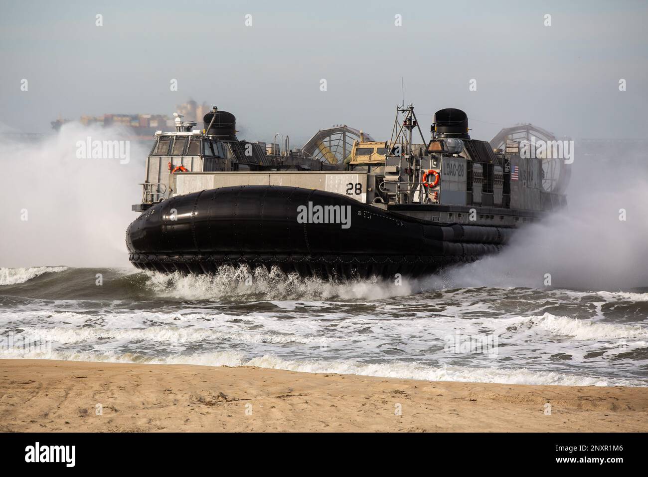 Landing Craft Air Cushion (LCAC) 28 lands on Utah Beach during ...