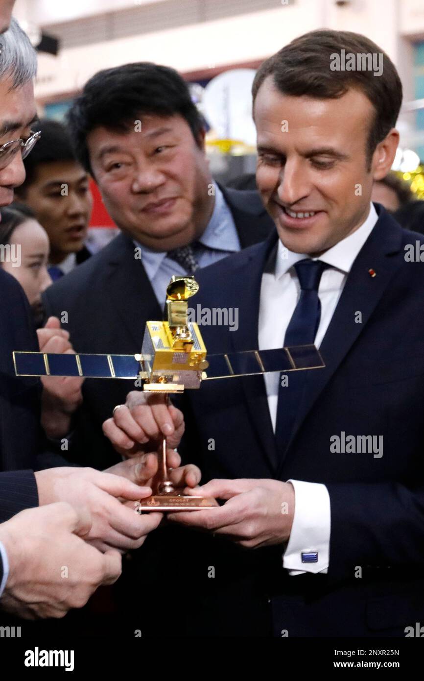 French President Emmanuel Macron receives a scale model of the CFOSAT ...