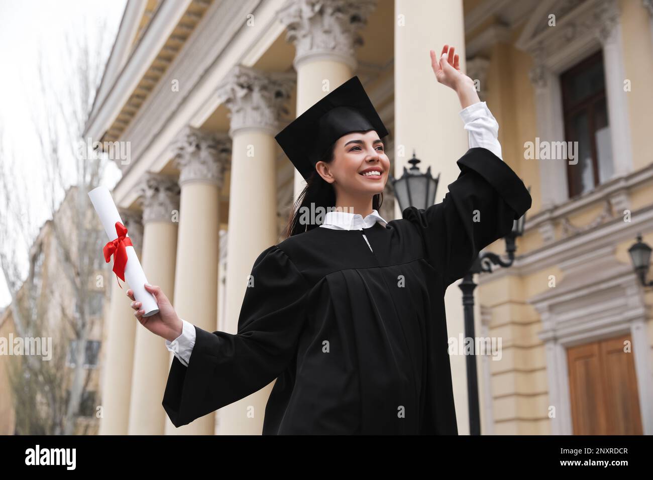 Happy student with diploma after graduation ceremony outdoors Stock ...