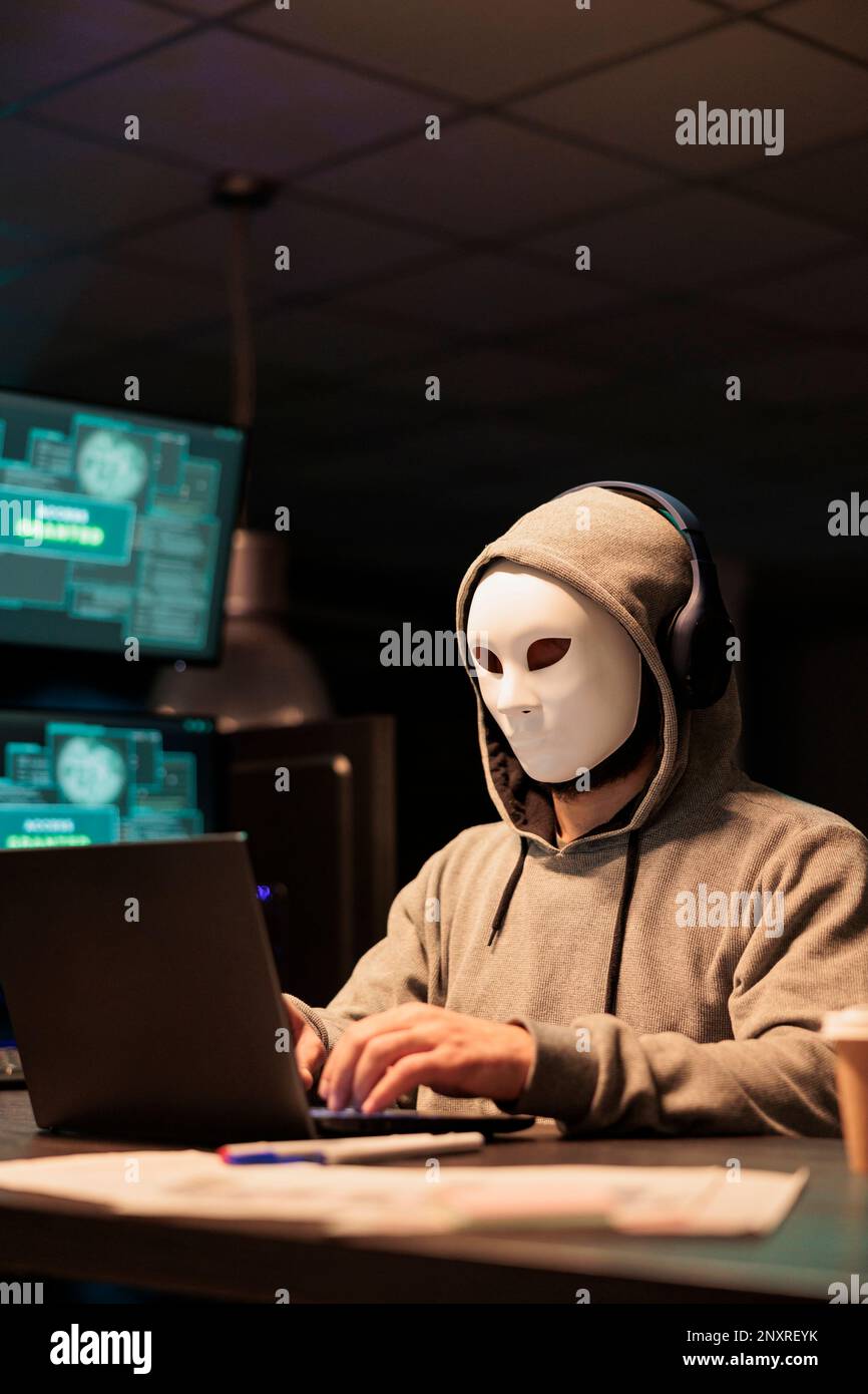 Masked man on computer hi-res stock photography and images - Alamy