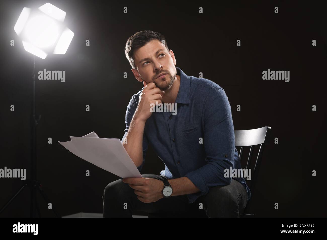 Professional actor reading his script during rehearsal in theatre Stock ...