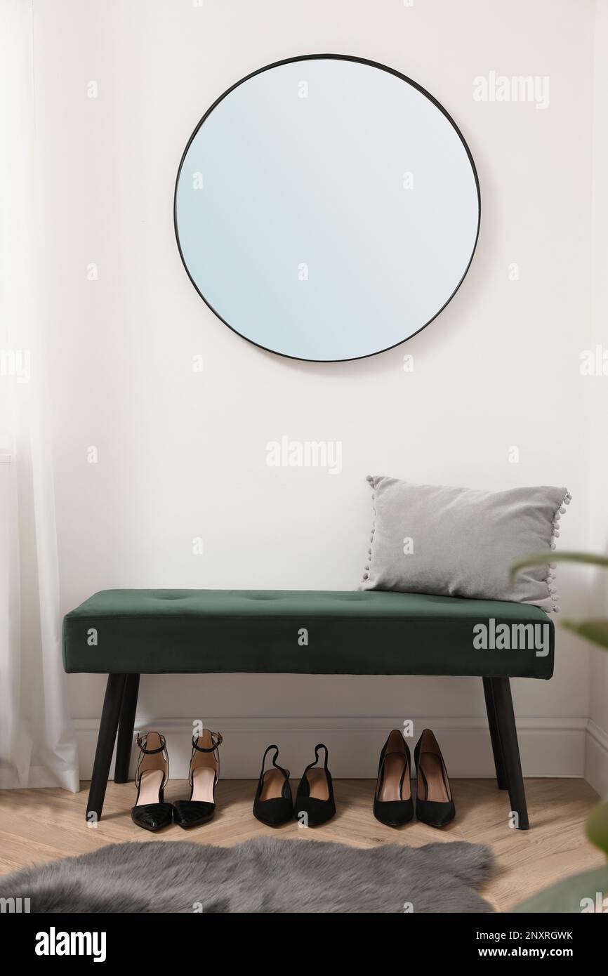 Green bench, mirror and women's shoes indoors. Interior design Stock ...