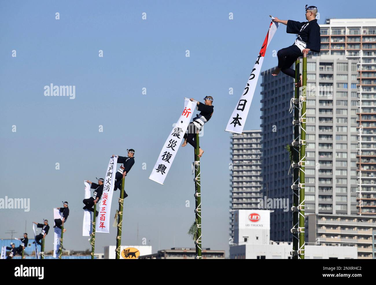 Performers of traditional firefighter show acrobatic ladder-climbing ...
