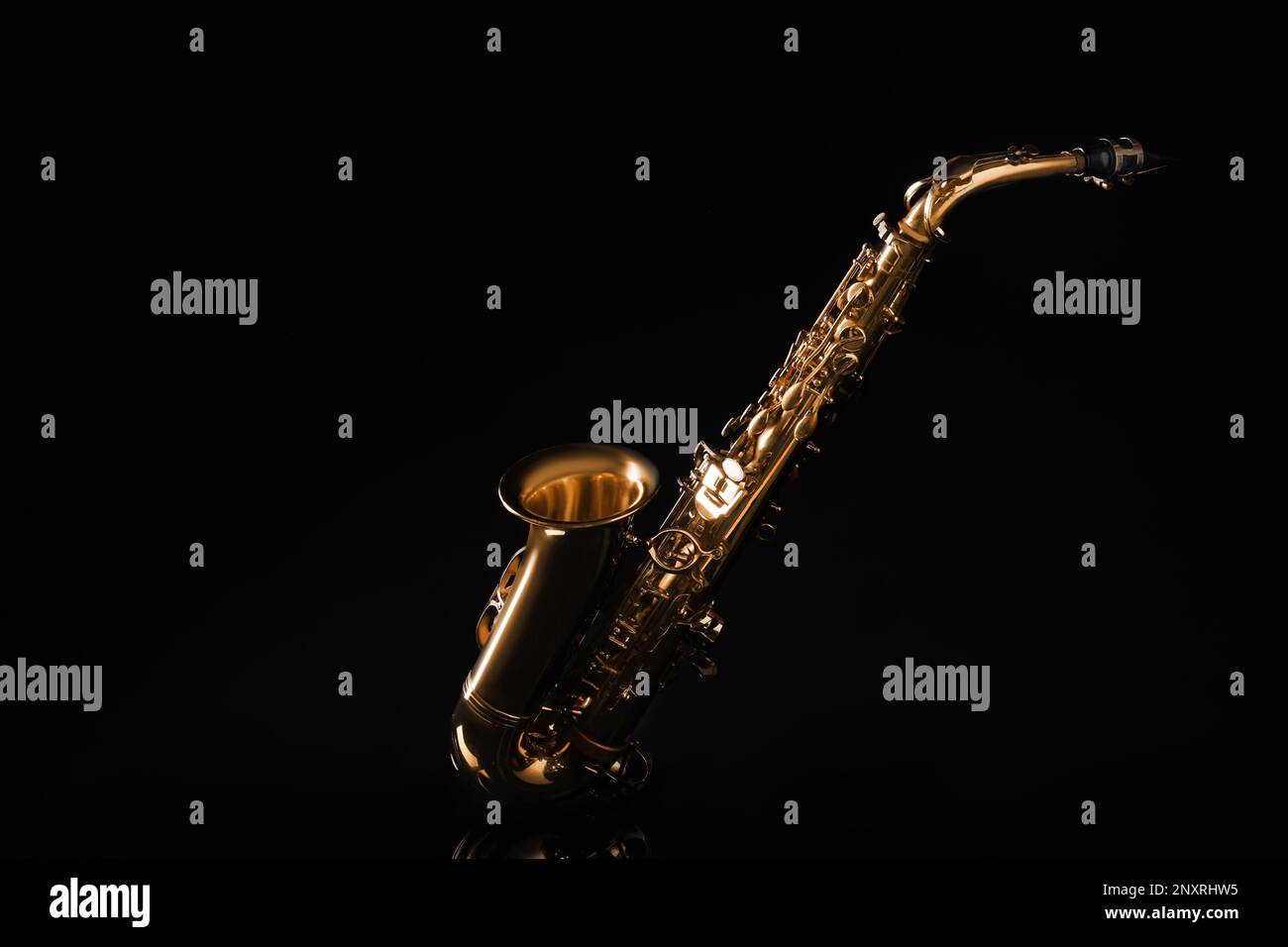 Beautiful saxophone on black background. Musical instrument Stock Photo ...