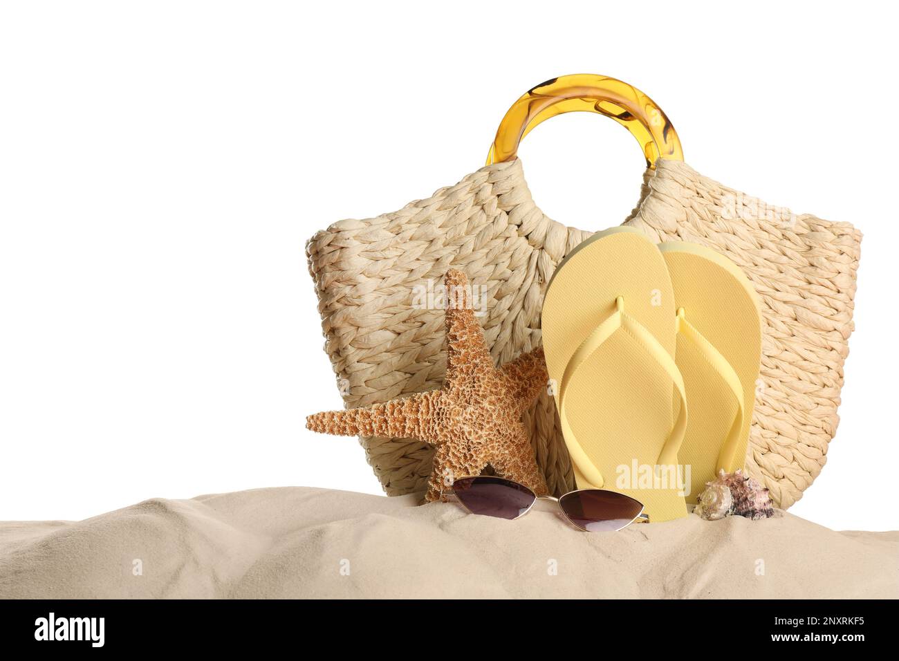 Bag and different beach objects on sand against white background Stock ...