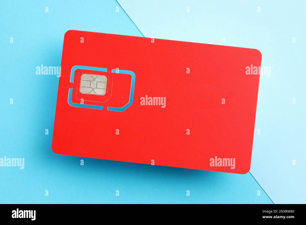 Red SIM card on color background, top view Stock Photo - Alamy