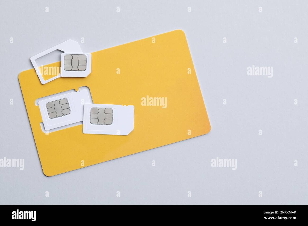 Modern SIM cards on light grey background, flat lay Stock Photo - Alamy