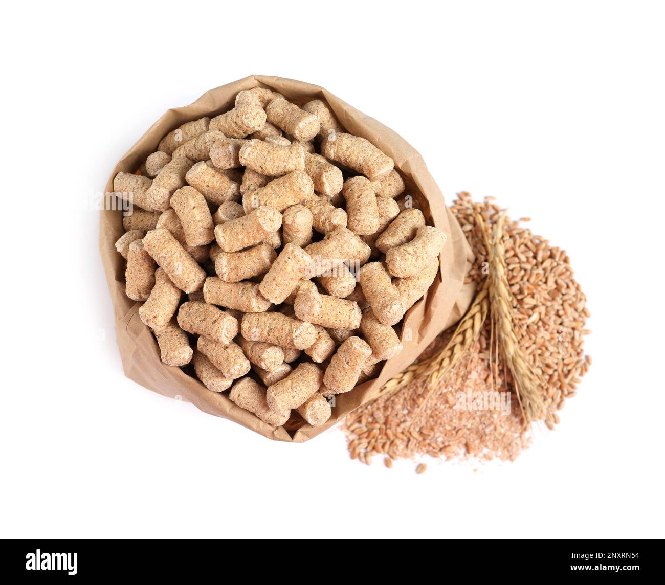 Granulated wheat bran in bag and spikelets on white background, top ...
