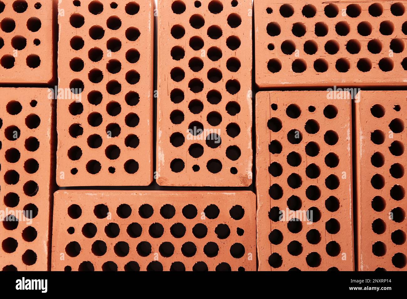 Red bricks wall as background. Building material Stock Photo - Alamy