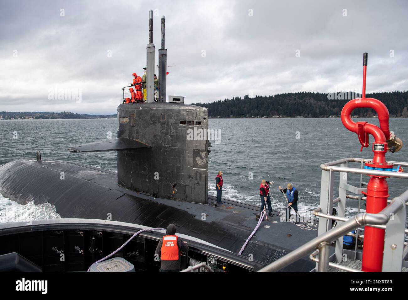 Sailors work aboard the Los Angeles-class fast-attack submarine USS ...