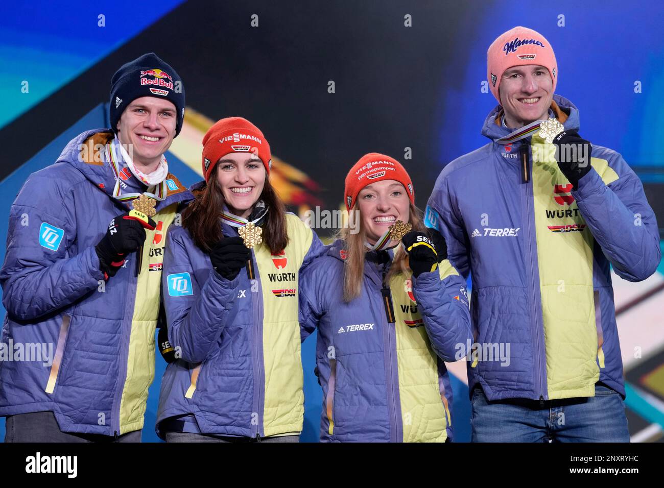 The team of Germany pose with their gold medals for the Ski Jumping ...