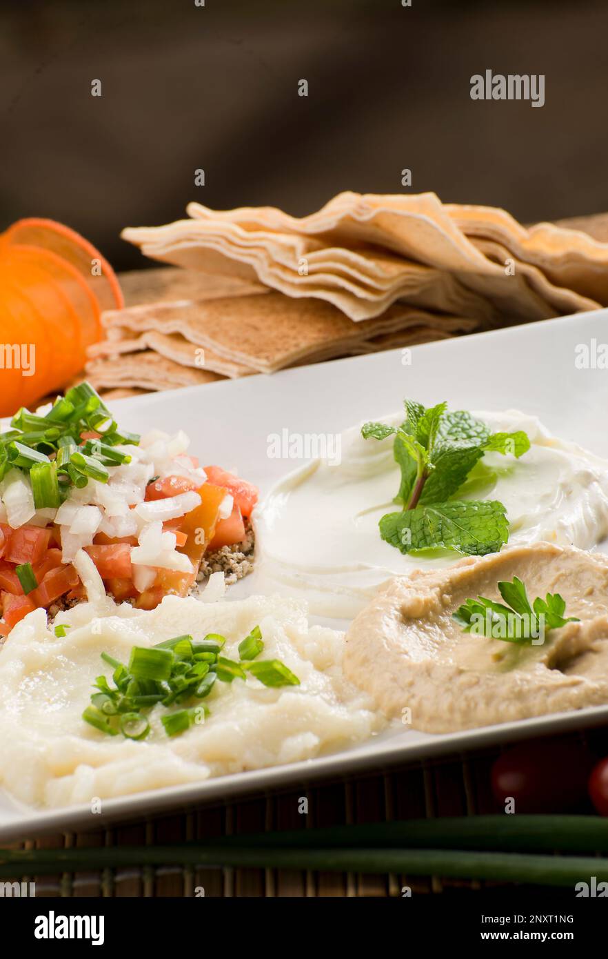 hommos, labneh, chancliche, garlic paste, arab food Stock Photo - Alamy